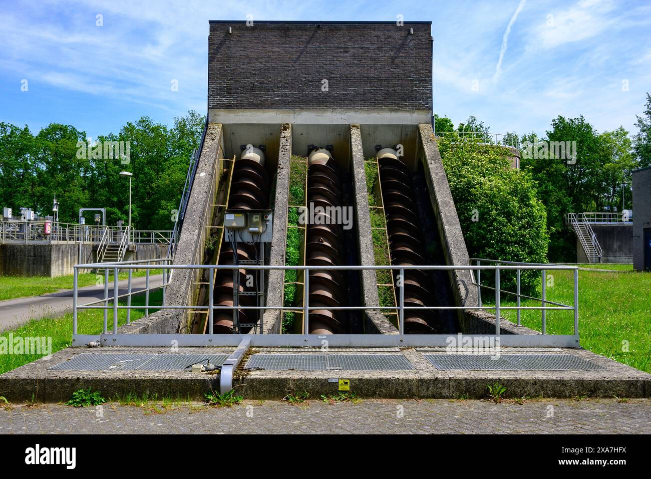 A massive concrete structure housing numerous pipes and pipe holes ...
