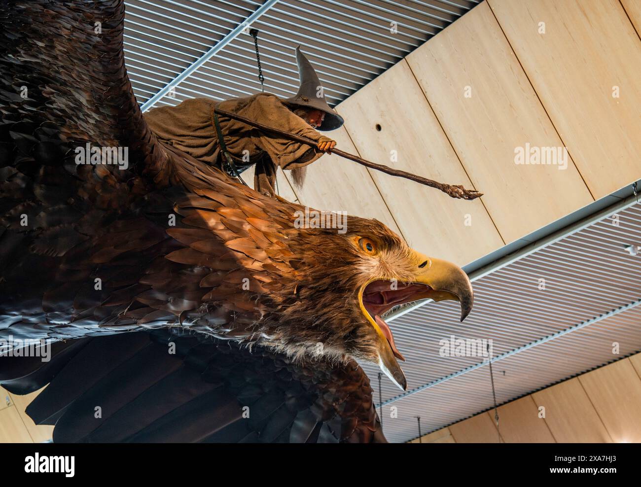 Wizard on eagle statue, guiding with staff Stock Photo - Alamy