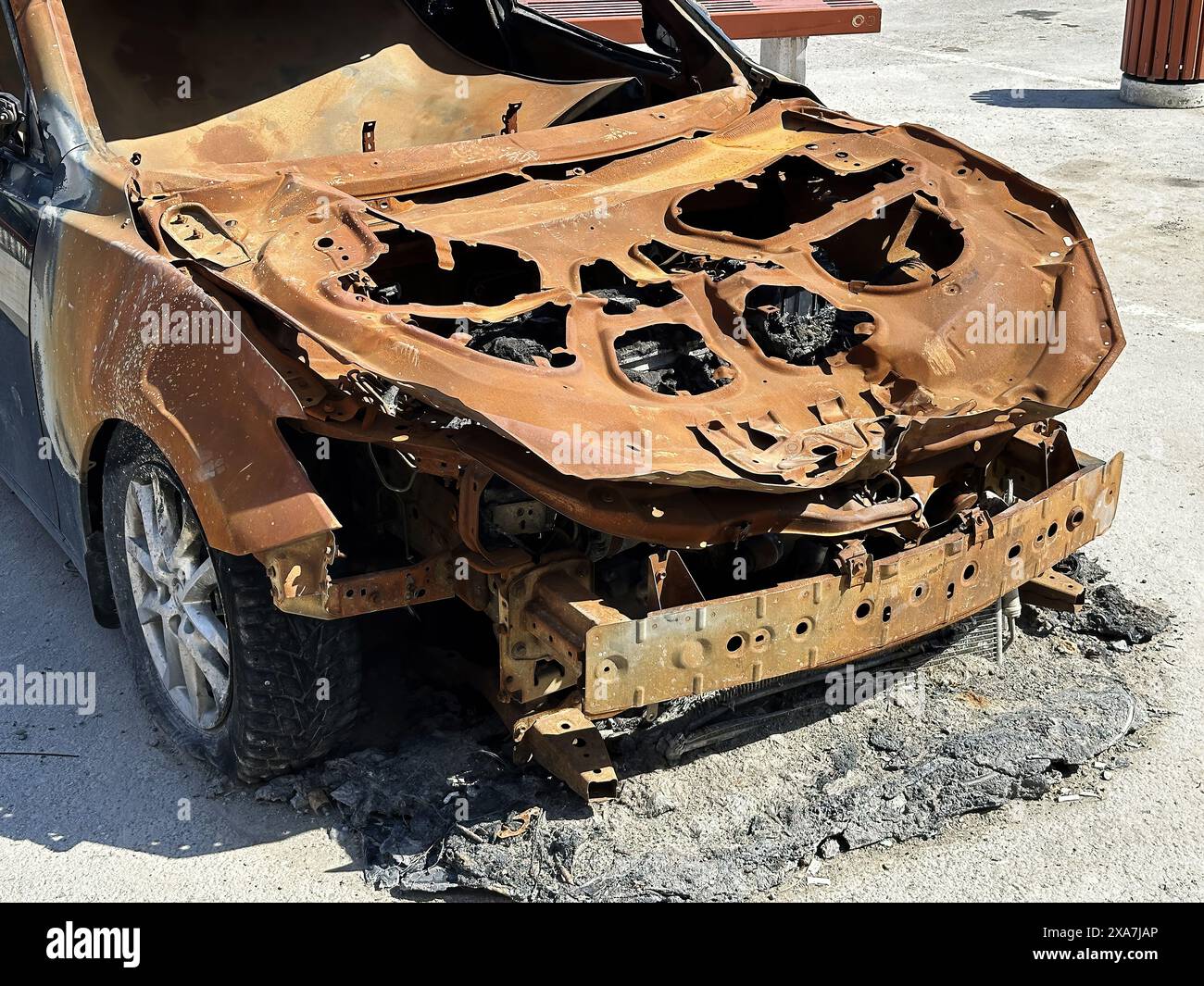 Old rusty burnt out car on the parking. Car insurance. Accident Stock ...