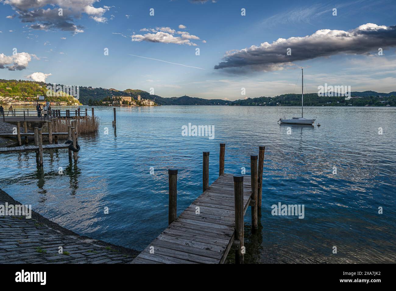 Wooden pier, view of Isola San Giulio from the harbor in Pella, Pella ...