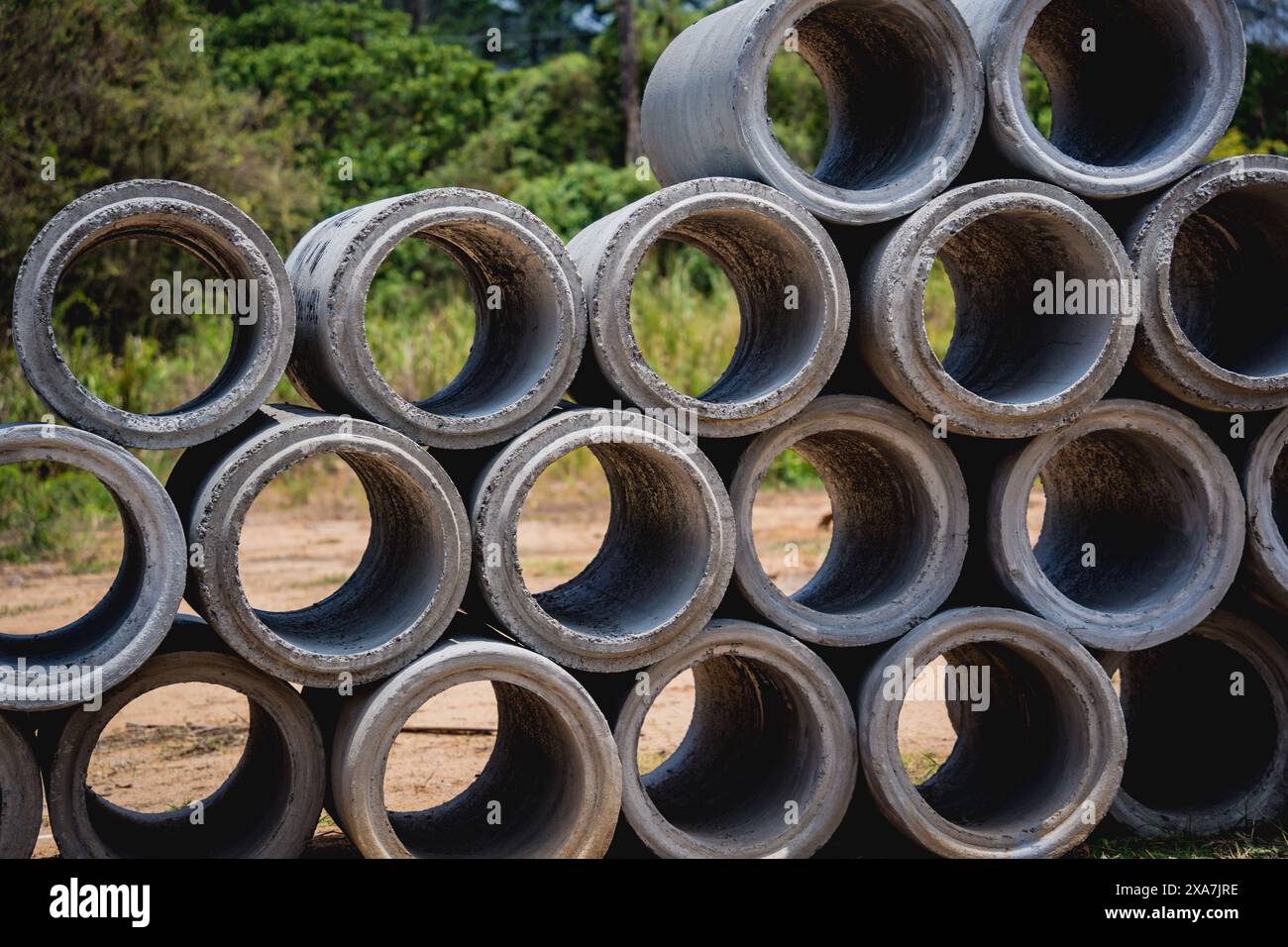 A stack of concrete ring pipes piled and creating a symmetrical ...