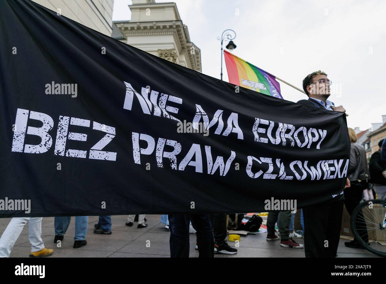 Protesters hold a banner with the inscription "No Europe without human ...