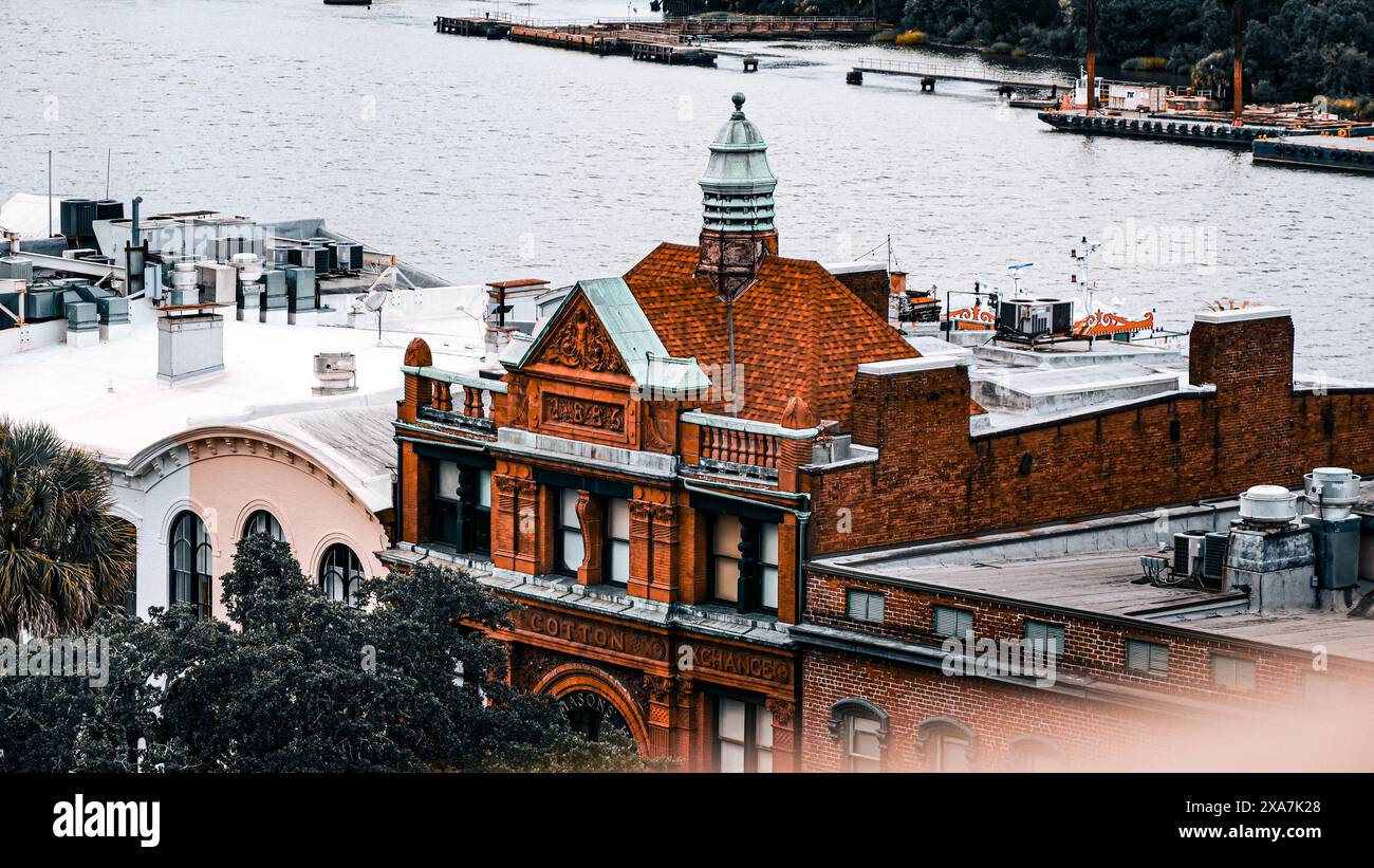 A grand waterfront building with an elaborate clock tower Stock Photo ...