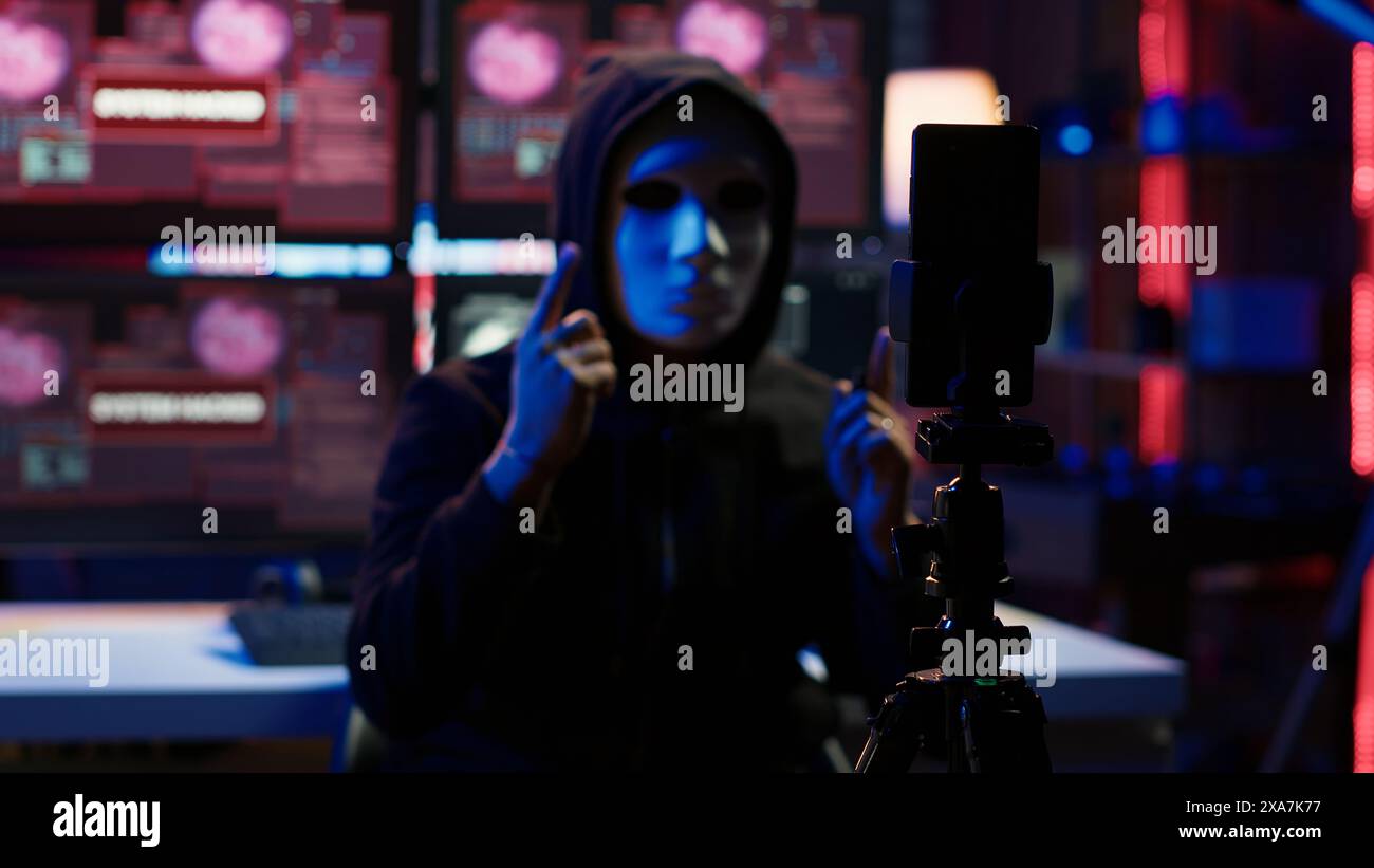 Hacker concealing identity filming hi-res stock photography and images ...