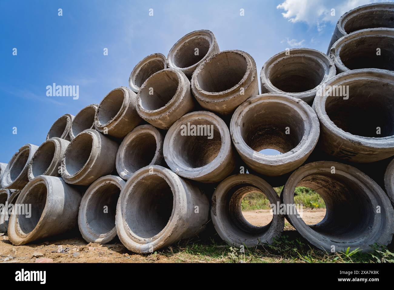 A stack of concrete ring pipes piled and creating a symmetrical ...