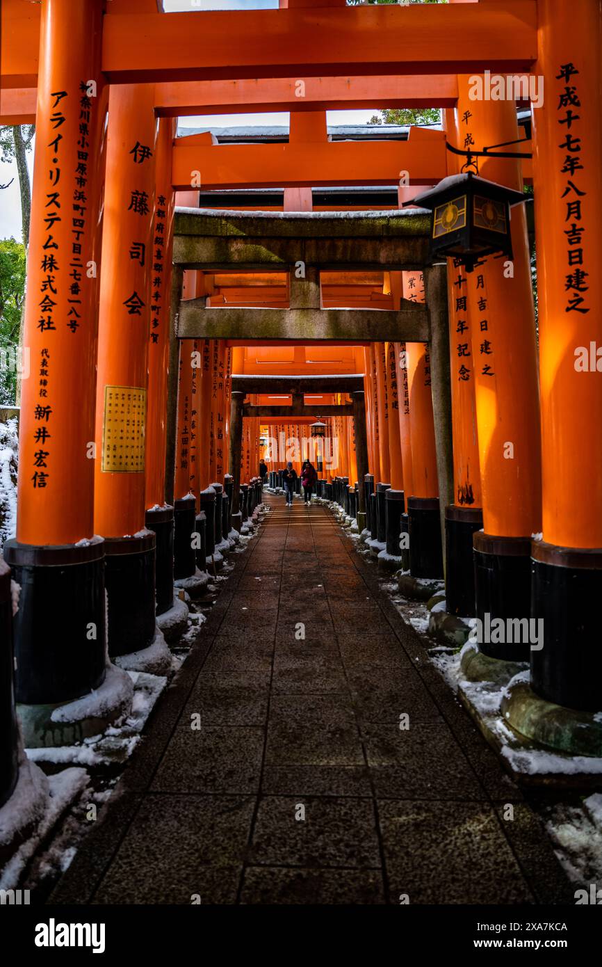 Rare Winter snow at ancient Torii Gate Tunnel at Fushimi Inari Shrine ...