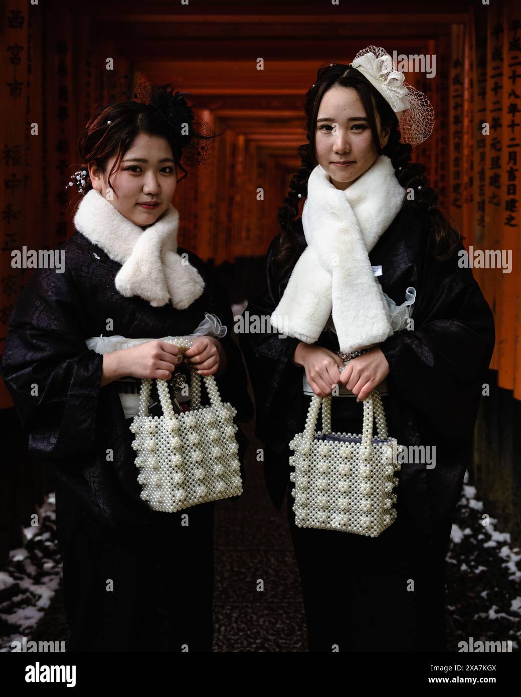 Two Young Japanese Women in formal winter attire posing in front of the ...