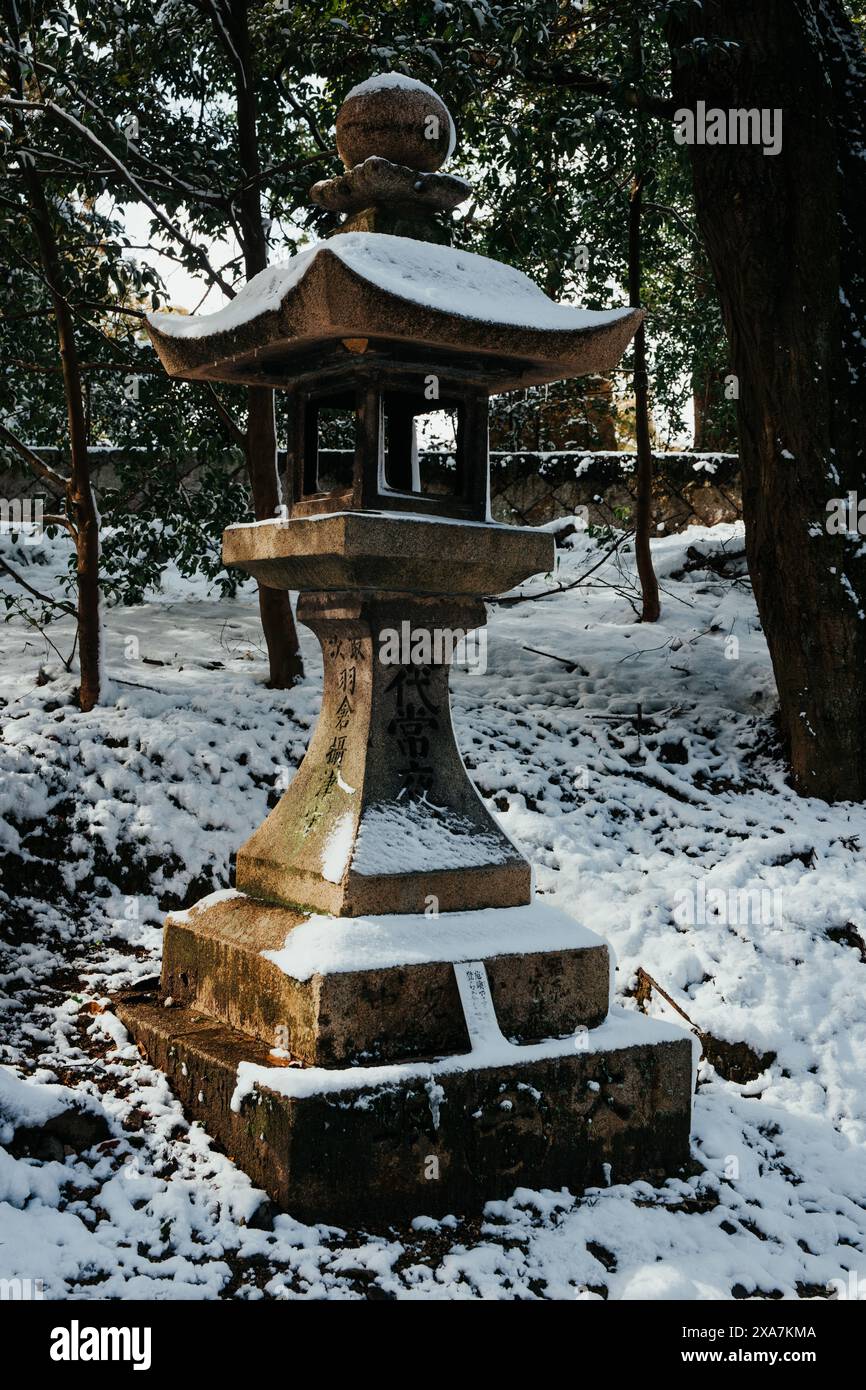 The Ancient style traditional Japanese lantern covered in rare winter ...