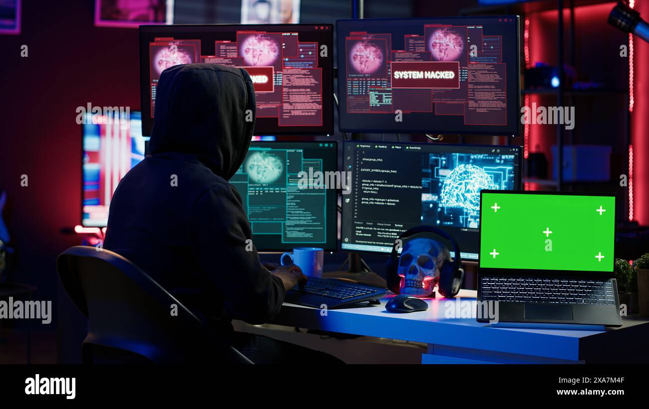 Hacker doing computer sabotage using trojan ransomware on green screen ...