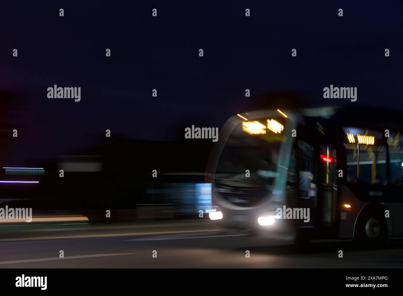 Showing cars and traffic at night, using camera panning to show car ...