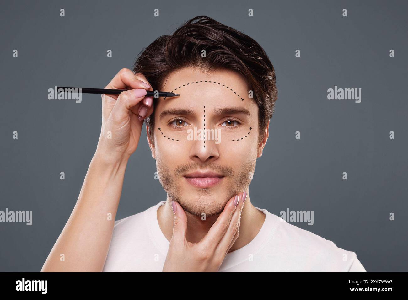 Surgeon drawing marks on male face, panorama Stock Photo - Alamy