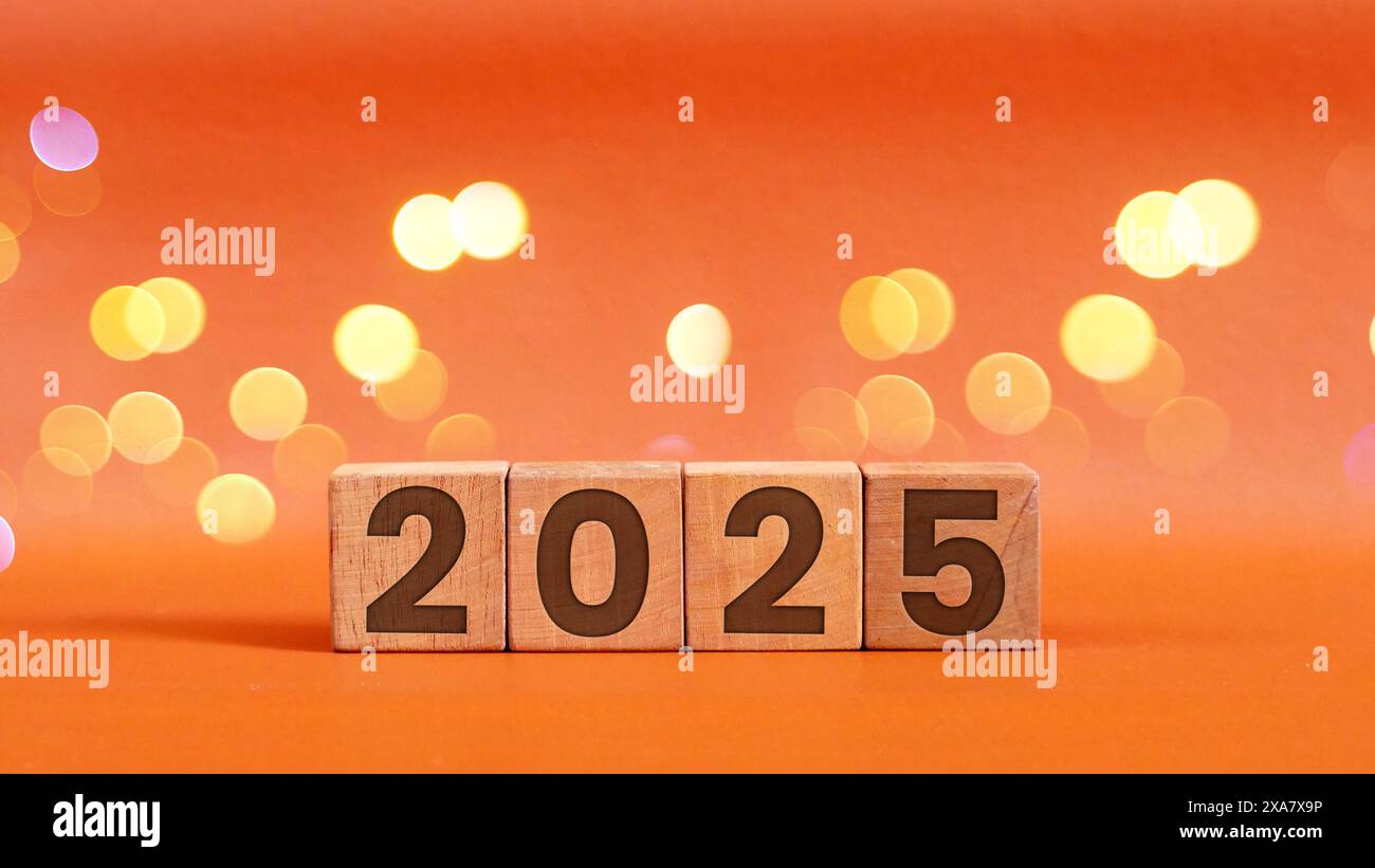 Business planning in 2025. Wooden cubes with numbers 2025 on table with bokeh background Stock ...