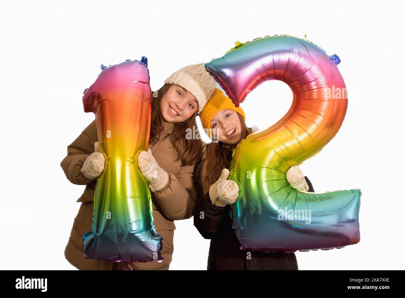 Girlfriends are holding large inflatable numbers 12 twelve. Girls 10-12 ...