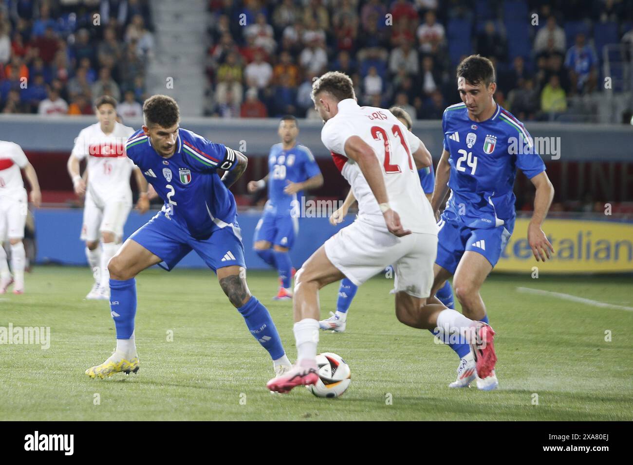 Bar?? Alper Y?lmaz of Turkiye battle for the ball with Giovanni Di ...