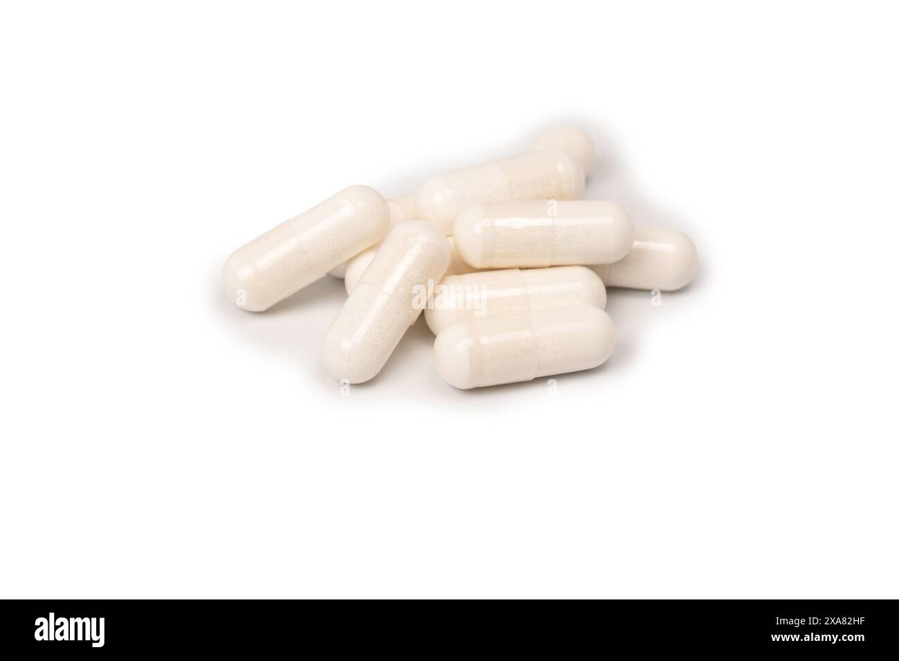 White pill capsule isolated on a white background Stock Photo - Alamy