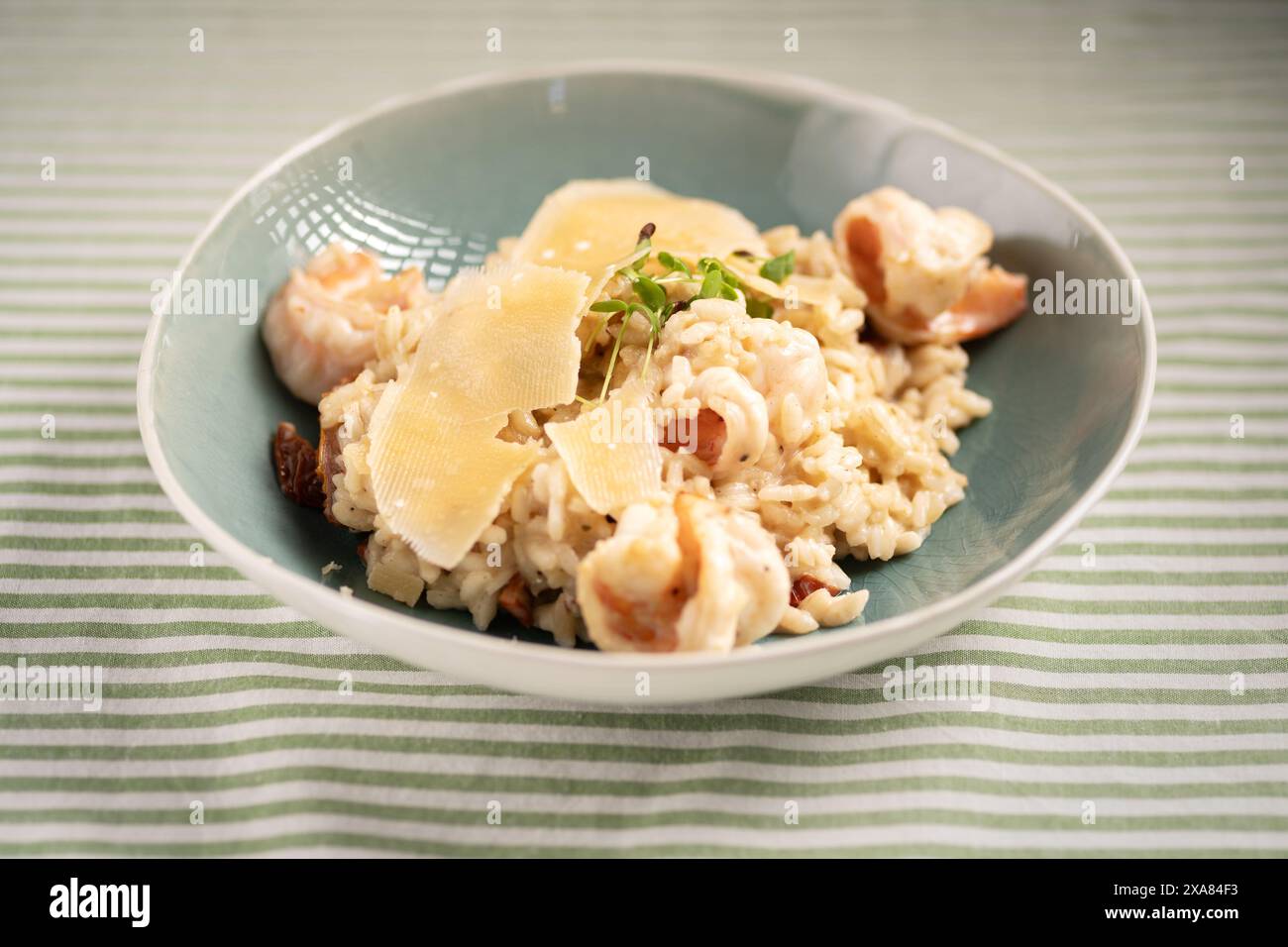 Traditional Italian dish risotto with seafood served on a plate in a ...