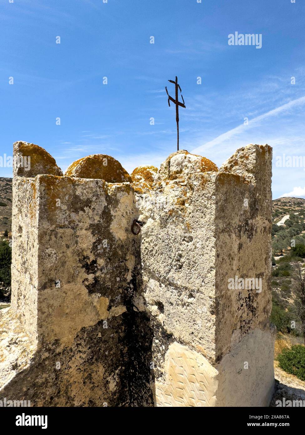 Stylised small old iron Byzantine double cross on pinnacle corner of ...
