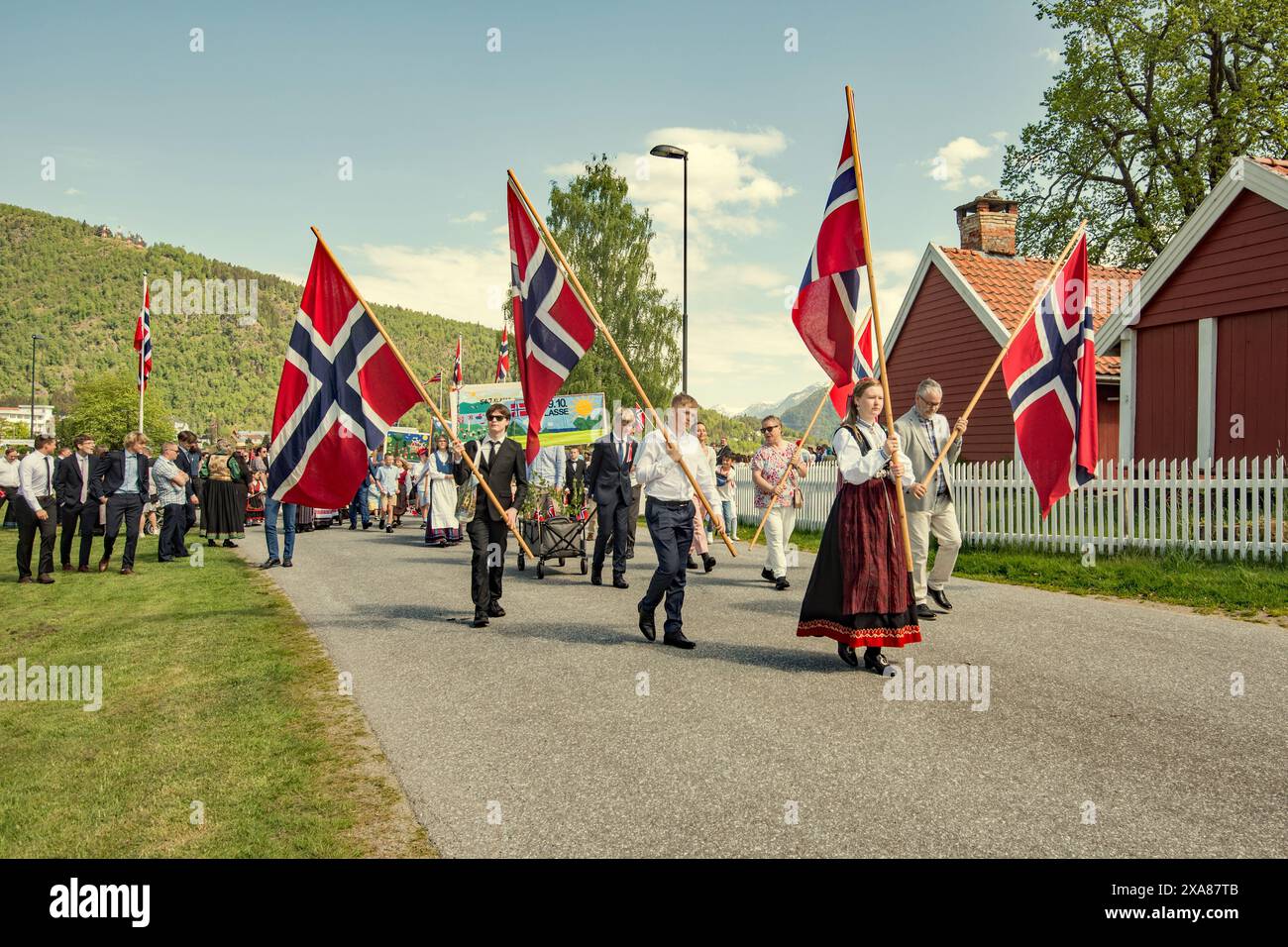 Street parade with Norwegian flags showing. This was in Balestrand ...