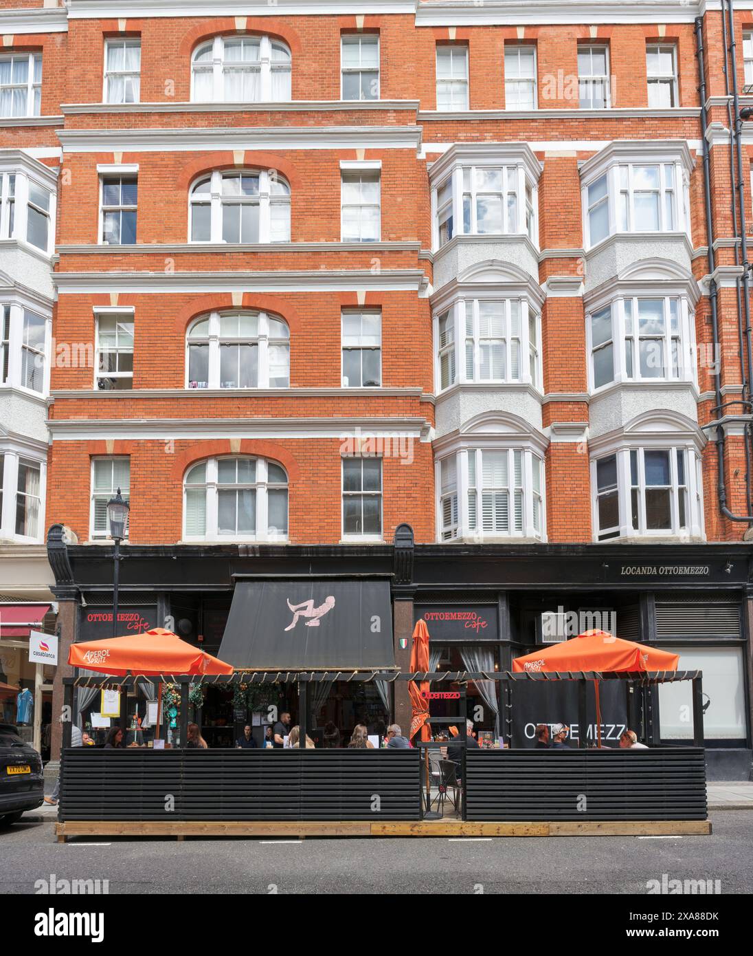Ottoemezzo Café, an outdoor cafe, in front of Durward House, an ...