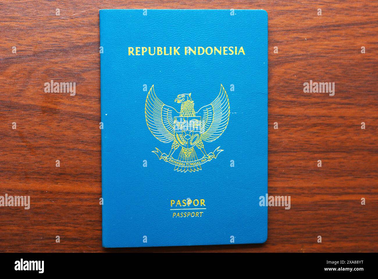 Indonesian passport on a wooden background Stock Photo - Alamy
