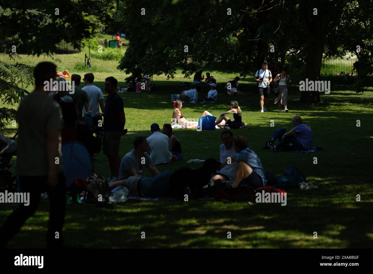 People enjoy a spell of hot weather as some sunbathe and others avoid ...