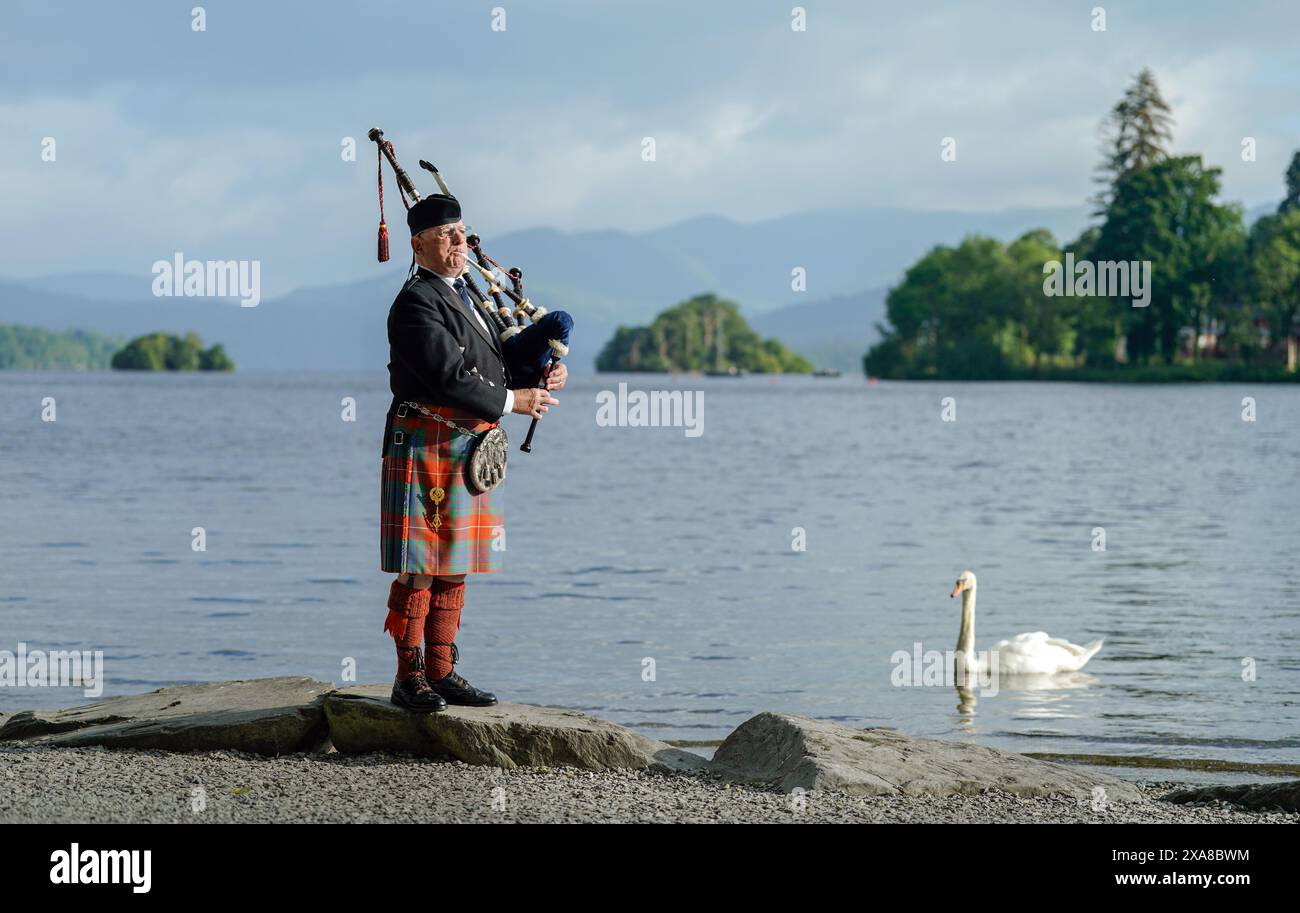 Lone bagpiper Richard Cowie, from the Cumbria Freemasons, warms up his ...