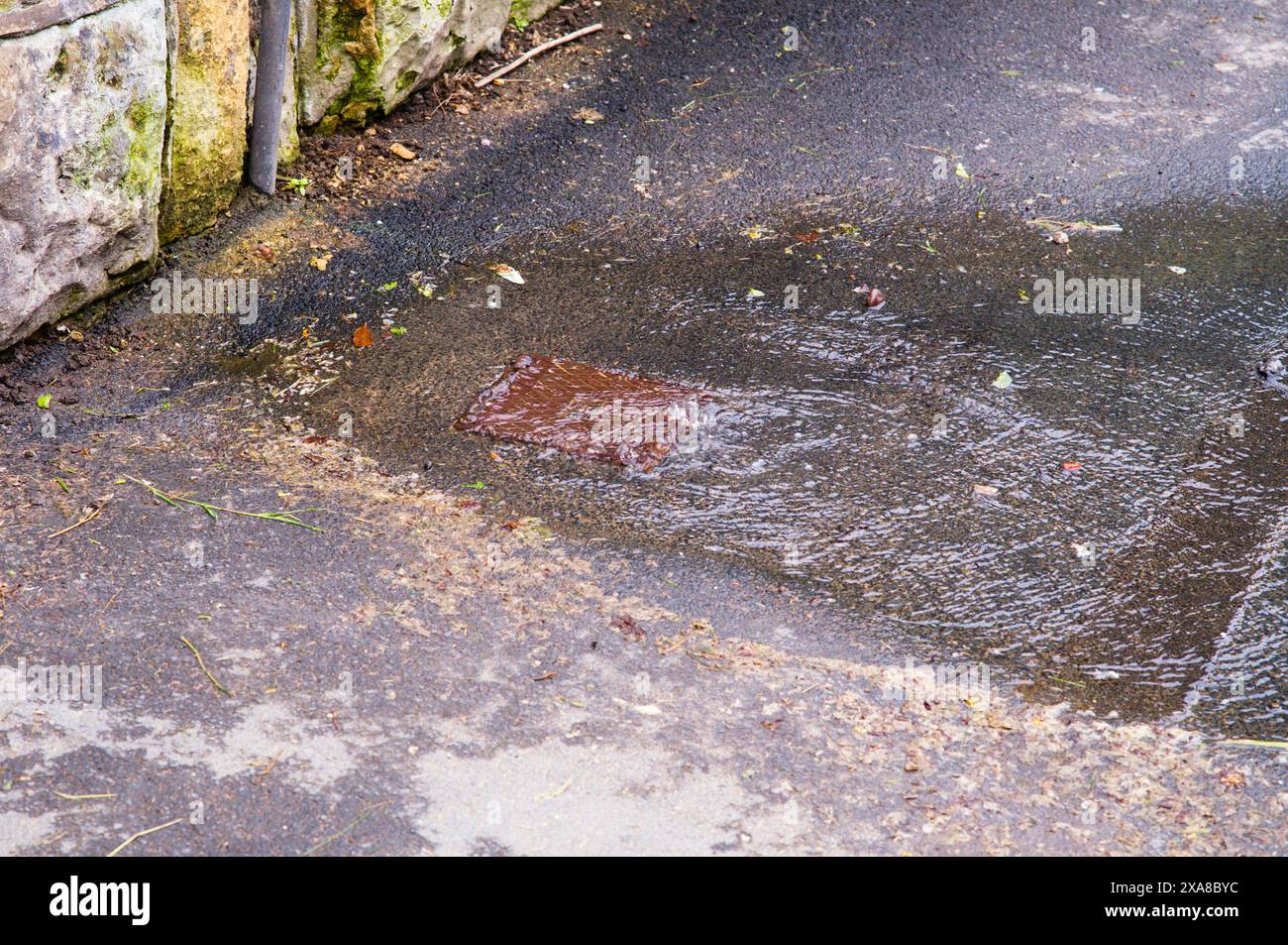Water pouring out of a Yorkshire water pavement cover in Scarborough ...
