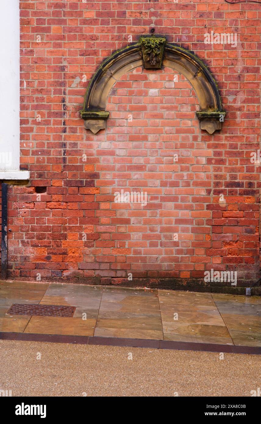 Brick wall with arch top stone work Stock Photo - Alamy