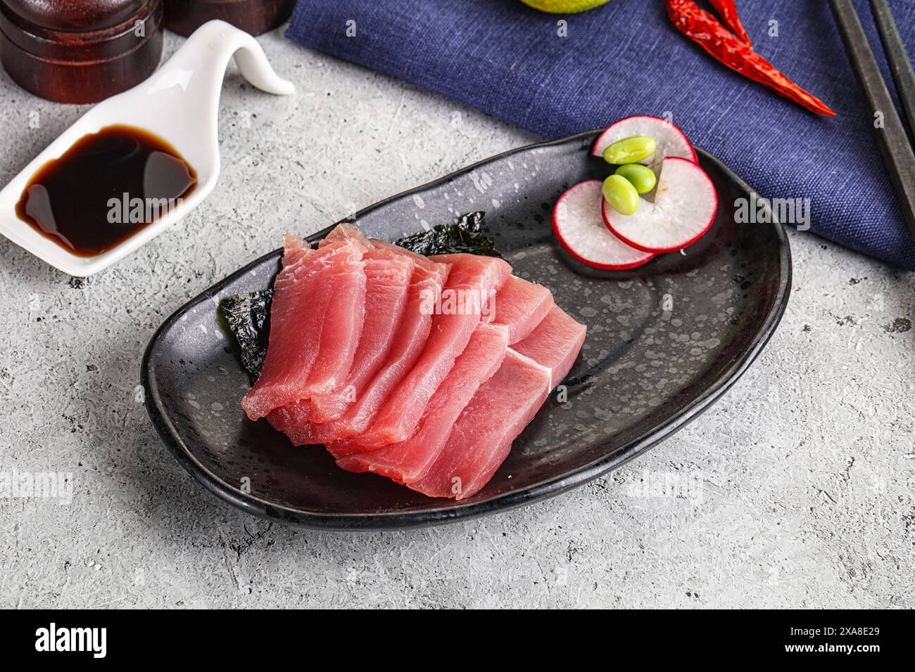 Japanese cuisine - sliced raw tuna sashimi Stock Photo - Alamy