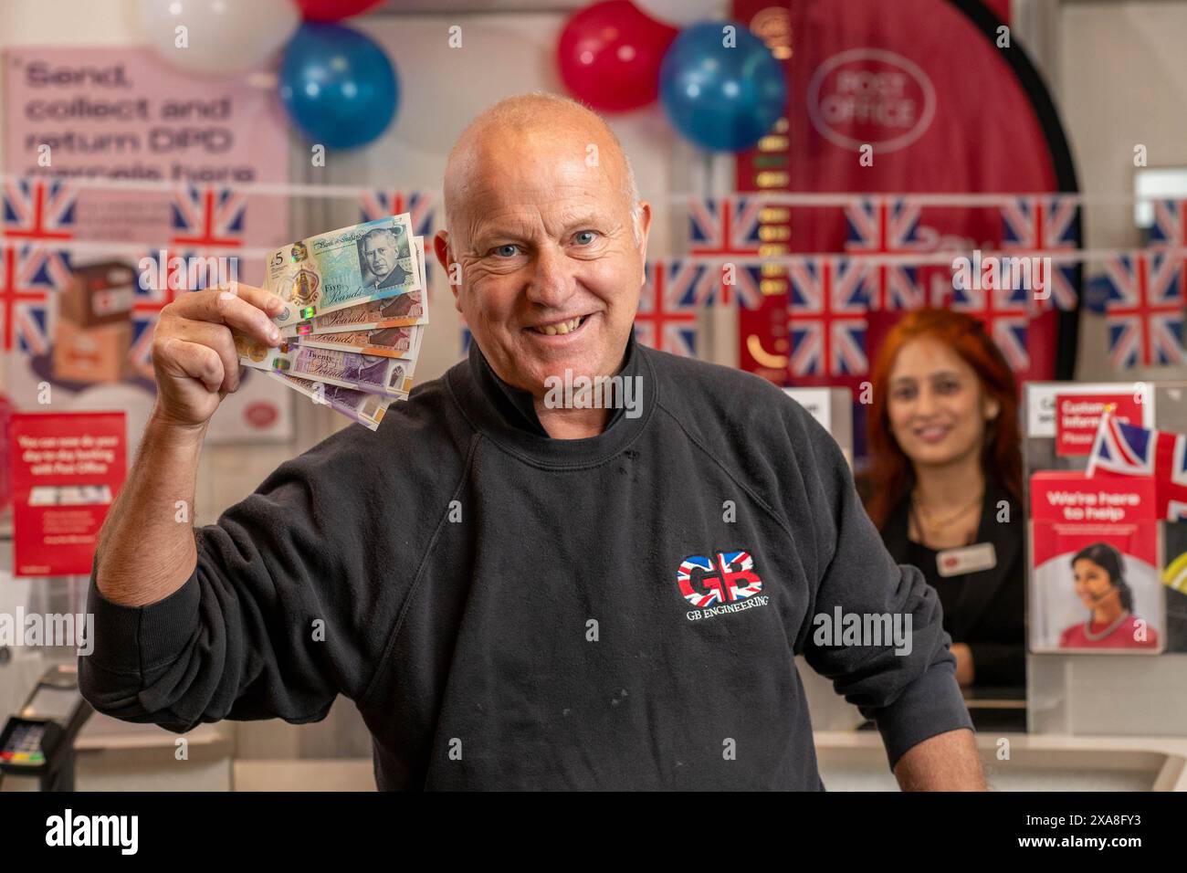 EDITORIAL USE ONLY Banknote collector, Colin Smoothy with the new-look ...