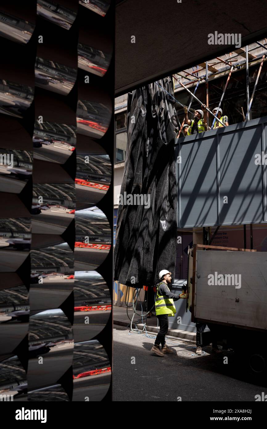 A Traffic Marshall oversees a safety curtain that surrounds a vehicle ...