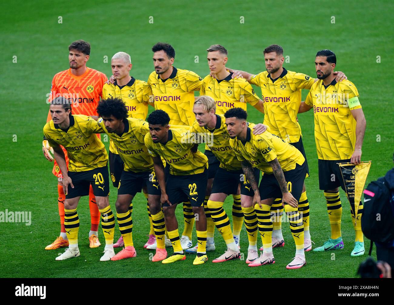 Borussia Dortmund players pose for a team photo on the pitch ahead of ...