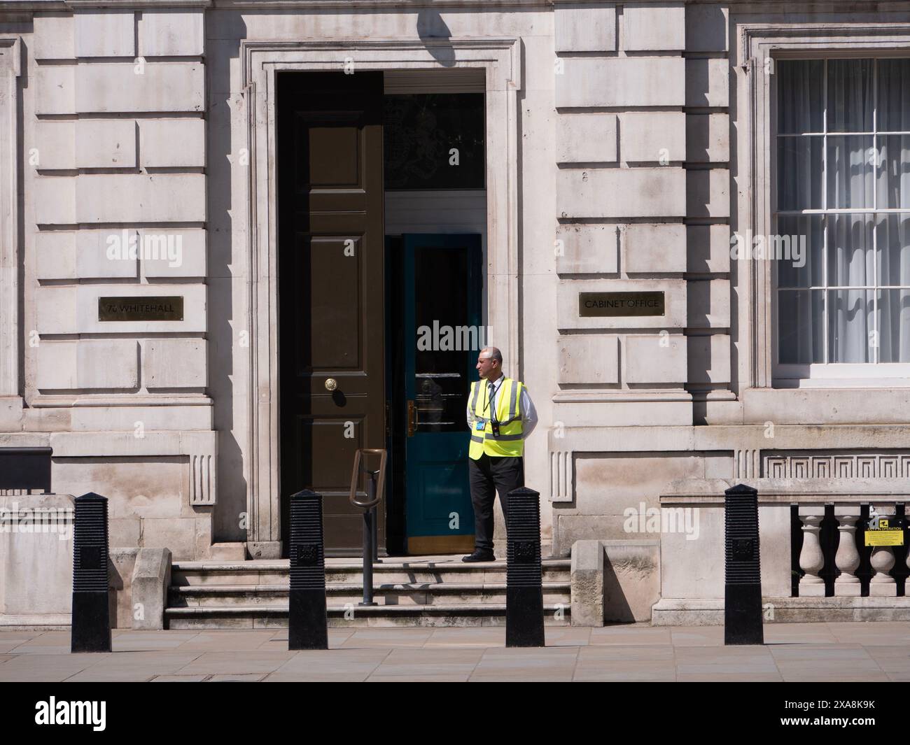 Security guard standing outside Cabinet Office central London Stock ...