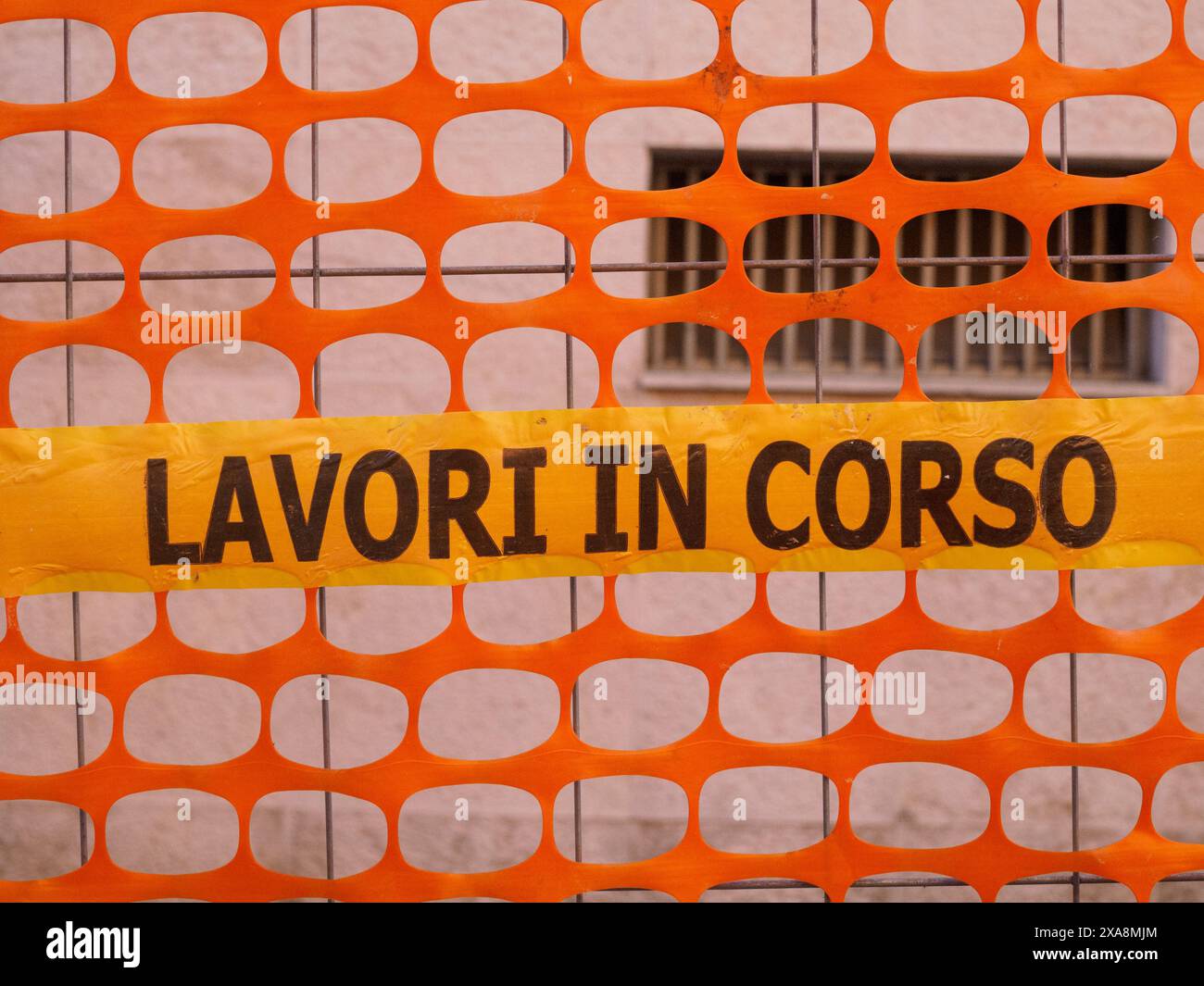 Cremona, Italy - May 27th 2024 Orange plastic construction site netting ...