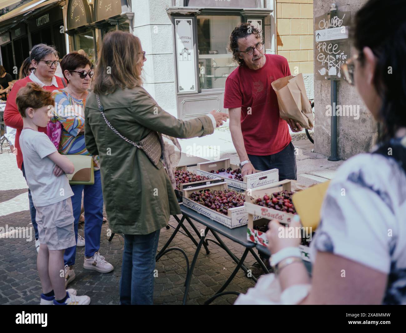 Cremona, Italy - May 27th 2024 Customers gathering around a fruit ...