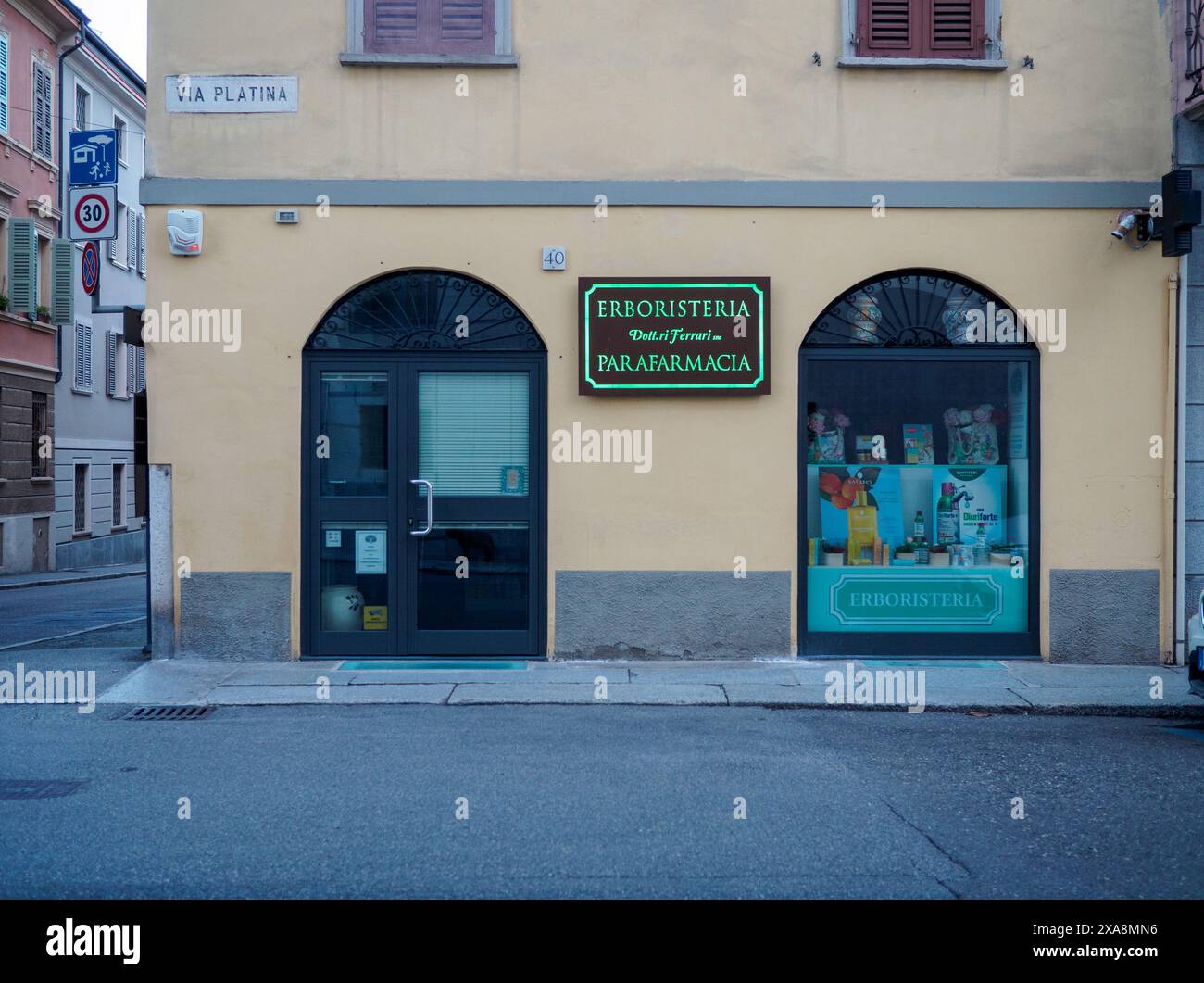 Cremona, Italy - May 27th 2024 Italian herbalist shop with green neon ...