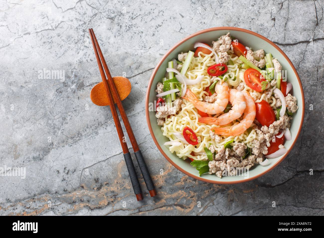 Thai Yum Mama salad with instant noodles, shrimp, minced pork, tomatoes ...