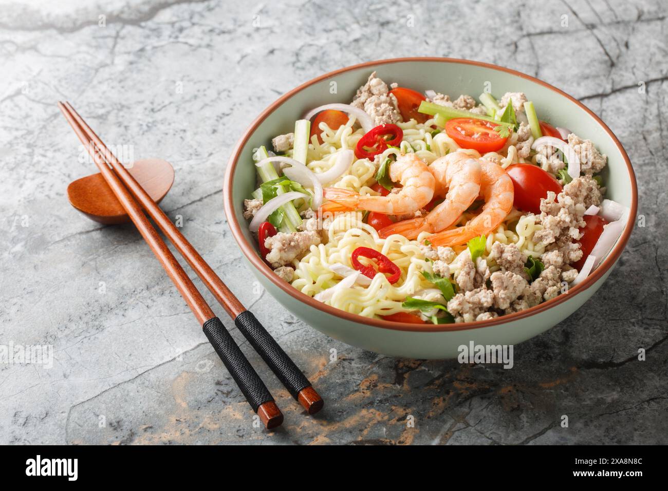 Thai Yum Mama salad with instant noodles, shrimp, minced pork, tomatoes ...