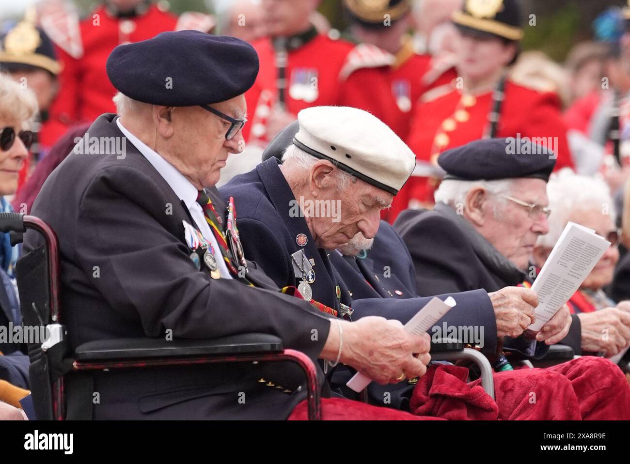 D-Day veterans Ken Hay, 98 (left) and Alec Penstone, 98 (second left) at the statue of Field ...