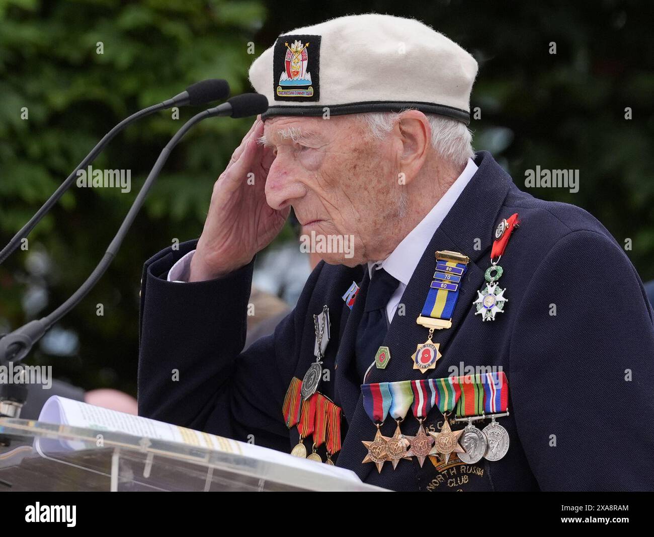 D-Day veteran Alec Penstone, 98, salutes as he speaks at the statue of ...