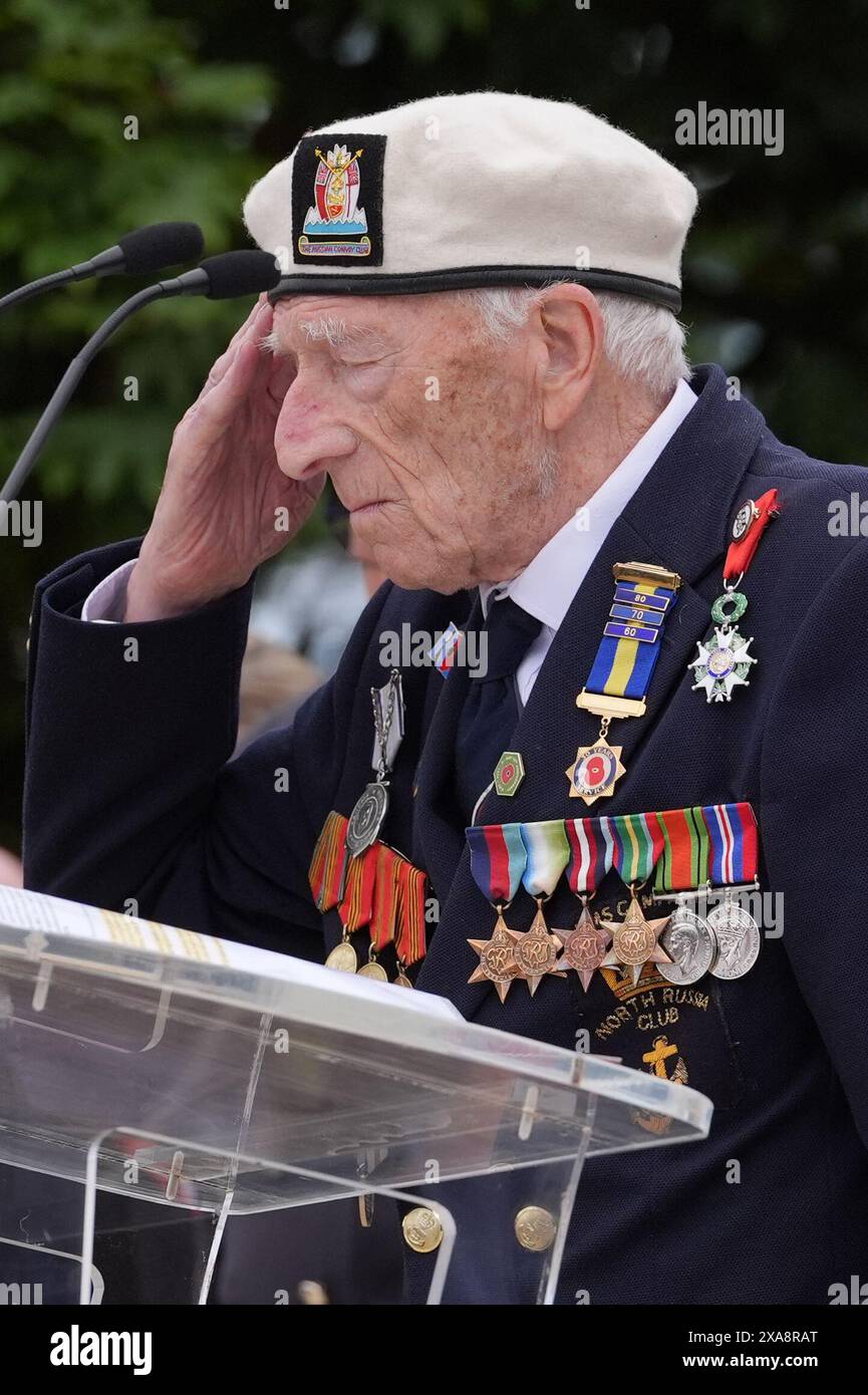 D-Day veteran Alec Penstone, 98, salutes as he speaks at the statue of ...