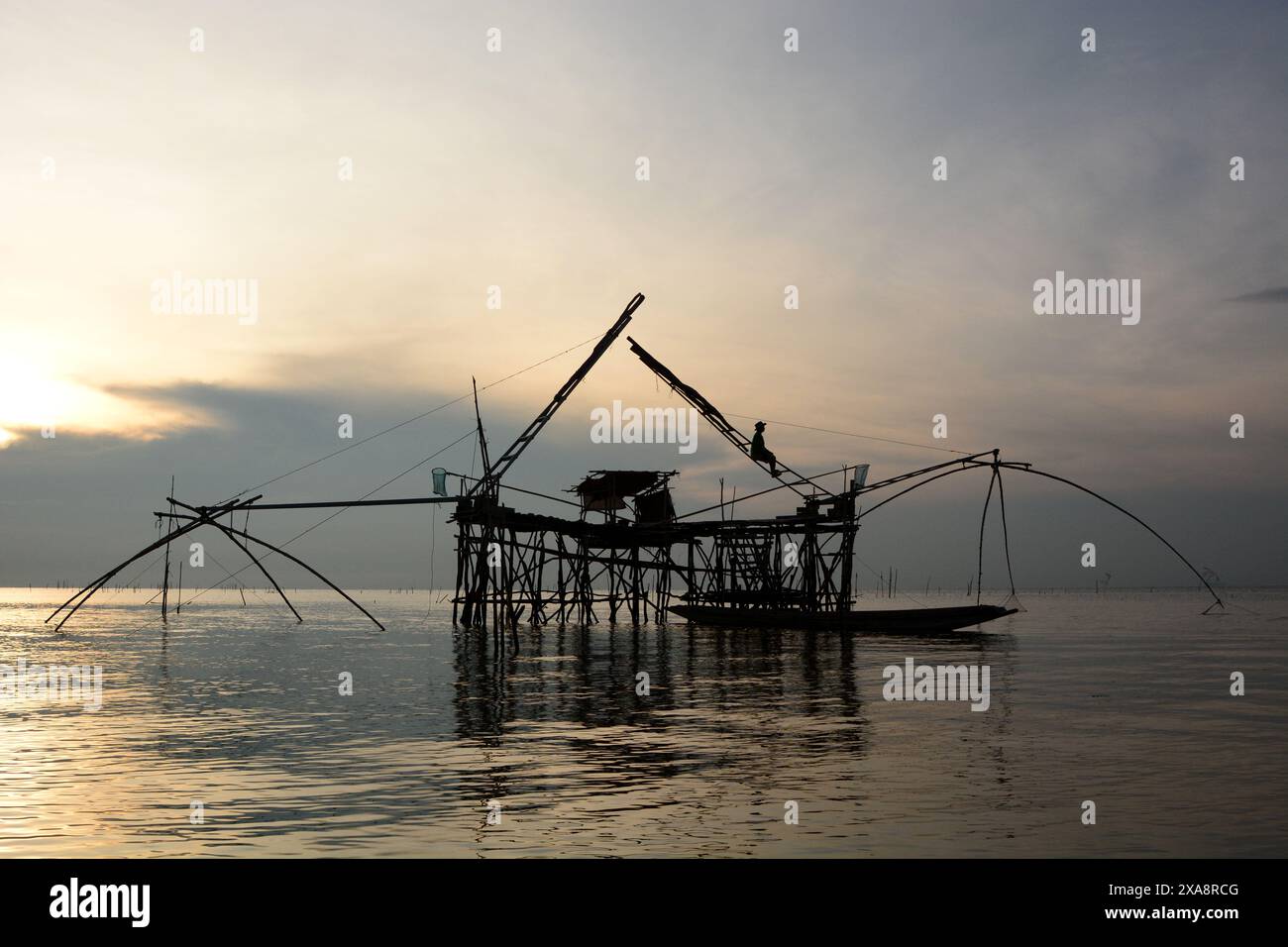 Fishing net silhouette at sunrise. Thale Luang. Phatthalung. Thailand ...