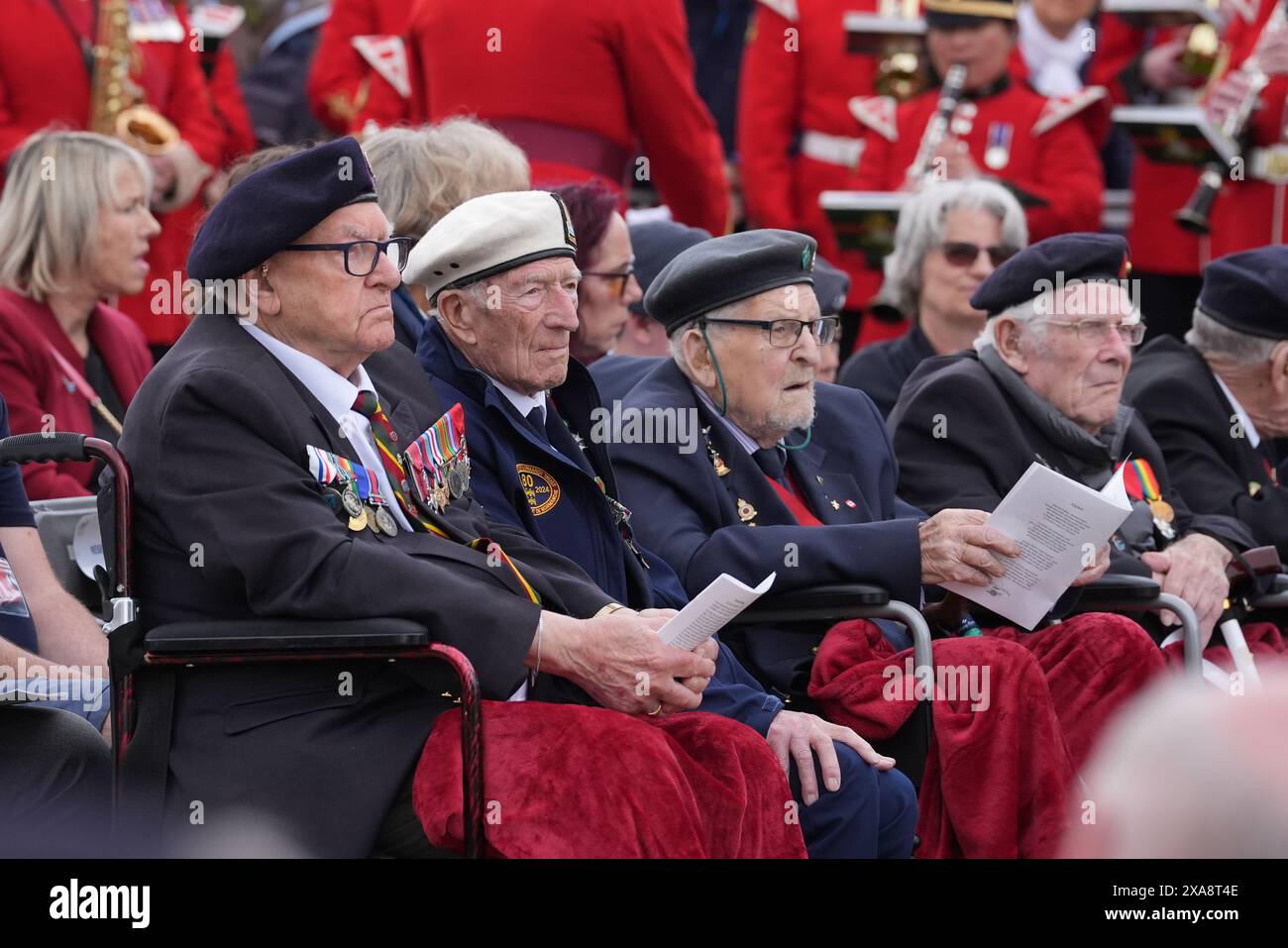D-Day veterans Ken Hay, 98 (left) and Alec Penstone, 98 (second left) at the statue of Field ...