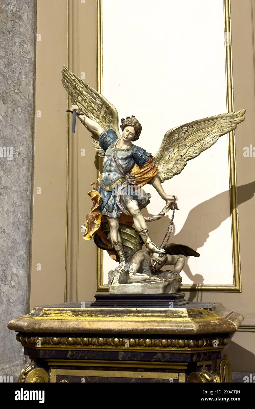 Statue of Michael the Archangel defeating the devil in the Metropolitan ...