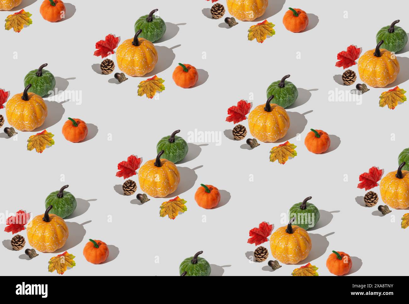 Trendy autumn or fall pattern made with pumpkins, yellow and red fallen ...