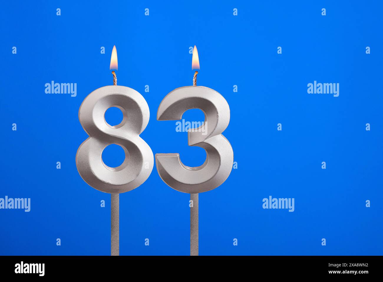 Birthday candle number 83 - Celebration card on blue background Stock ...