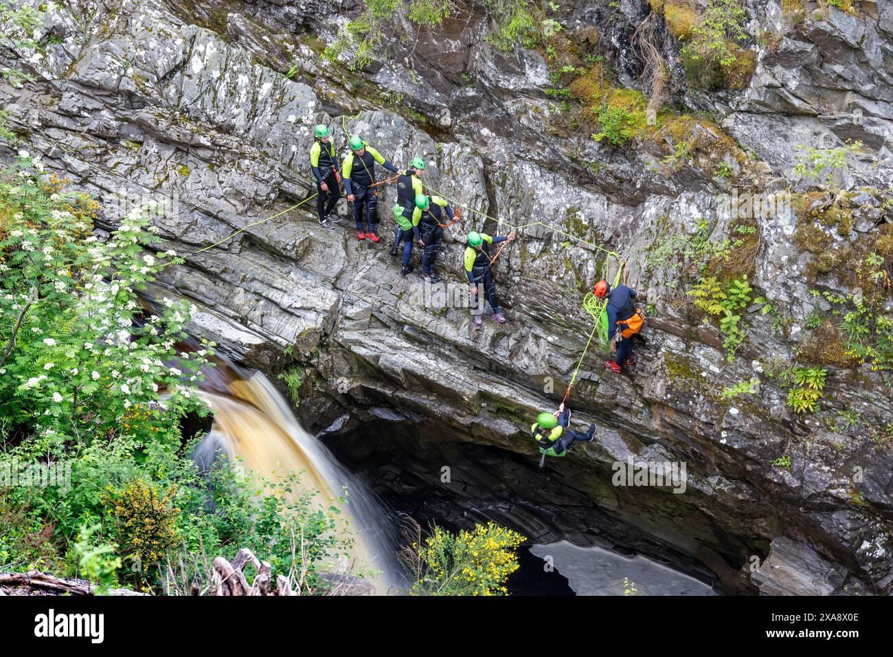 PITLOCHRY, PERTHSHIRE, SCOTLAND, UK, MAY 28. Teenagers traversing ...
