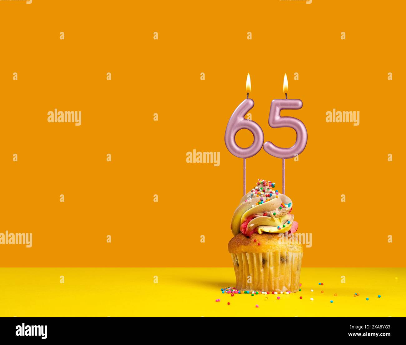Birthday celebration with cupcake - Candle number 65 Stock Photo - Alamy