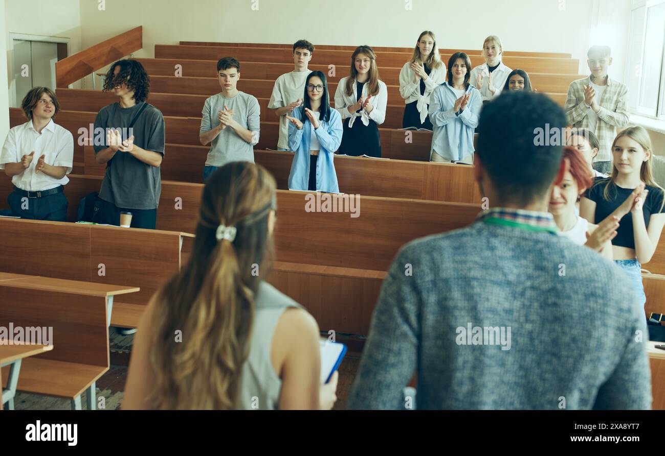 Two teacher, lectures leading workshop for multiracial group of ...