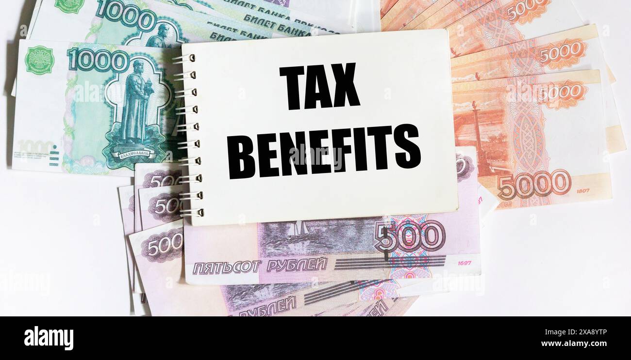 On the notepad there is the inscription TAX BENEFITS against the ...